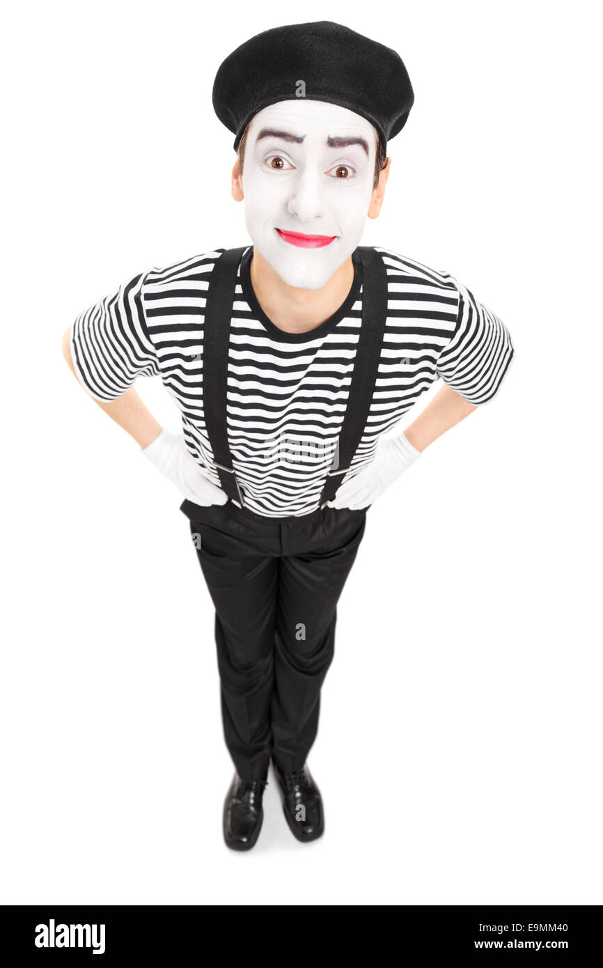 Vertical shot of a joyful mime artist isolated on white background ...