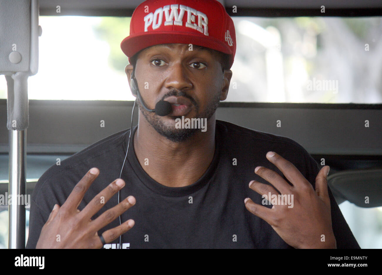 Tour guide Van guides a group of tourist on a bus tour through Los ...