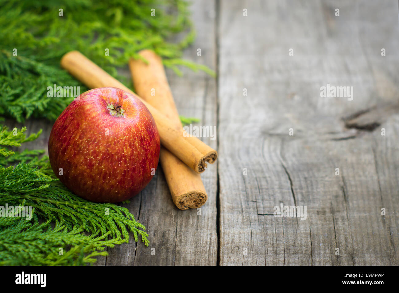 Red Apple with cinnamon sticks Stock Photo - Alamy