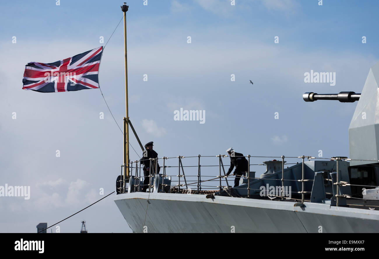 Sailors raise the Union Jack on the bow of the Type 23 frigate HMS ...