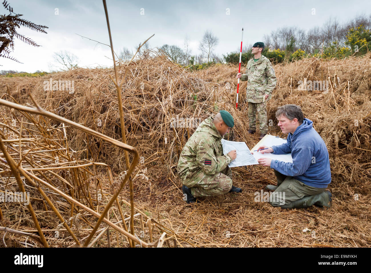 Soldiers help Richard Osgood, MOD Archaeologist to map overgrown trench ...
