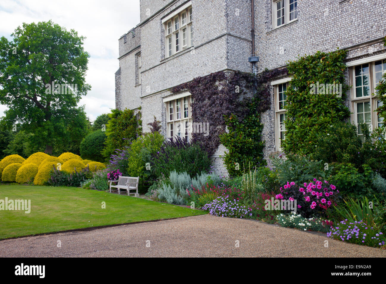 The borders and clipped hedges in front of West Dean College, West ...