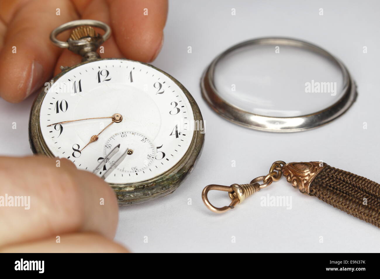 Human hand holding wrist watch hi-res stock photography and images - Alamy