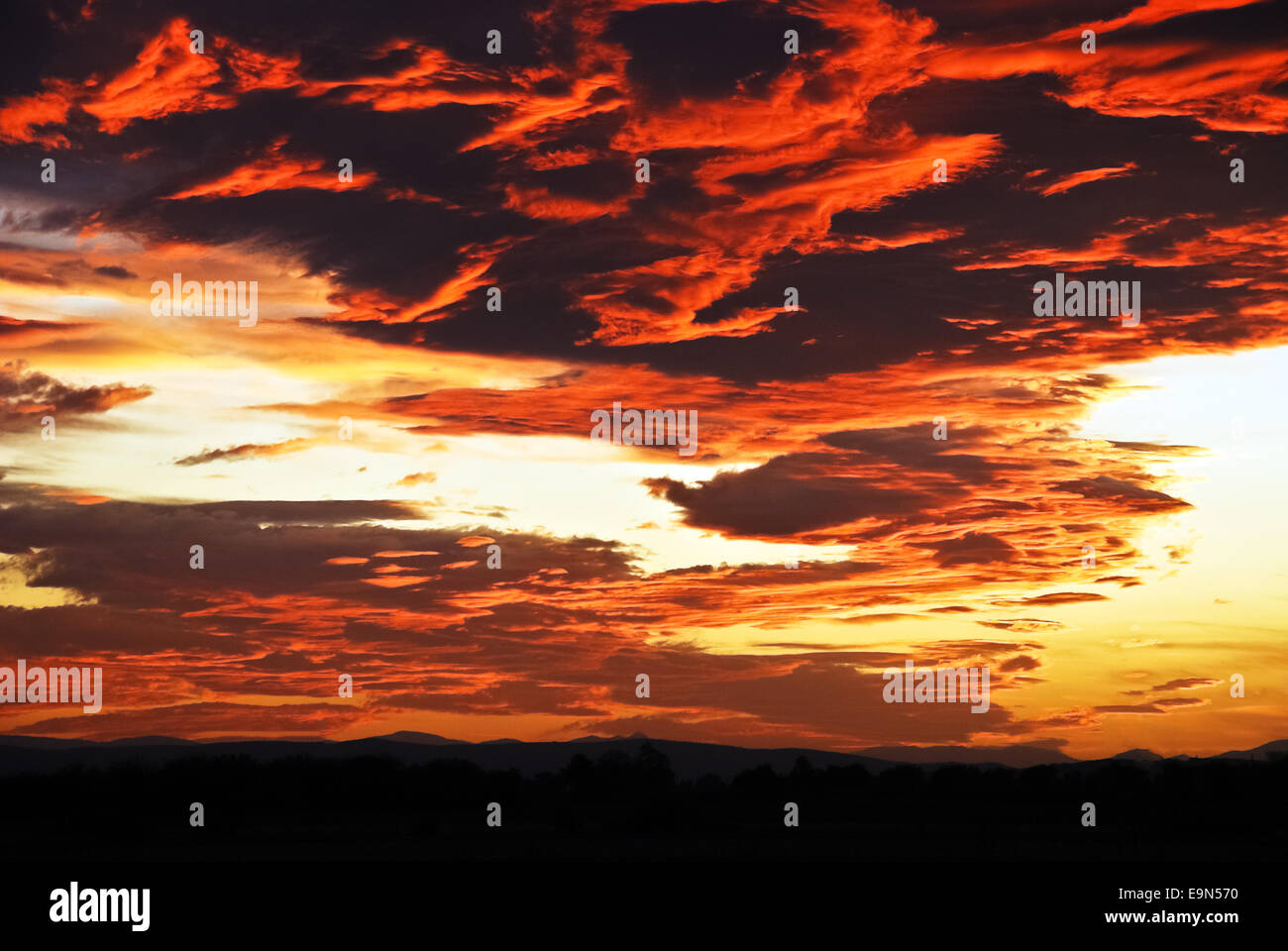 glowing red clouds at sunset Stock Photo - Alamy