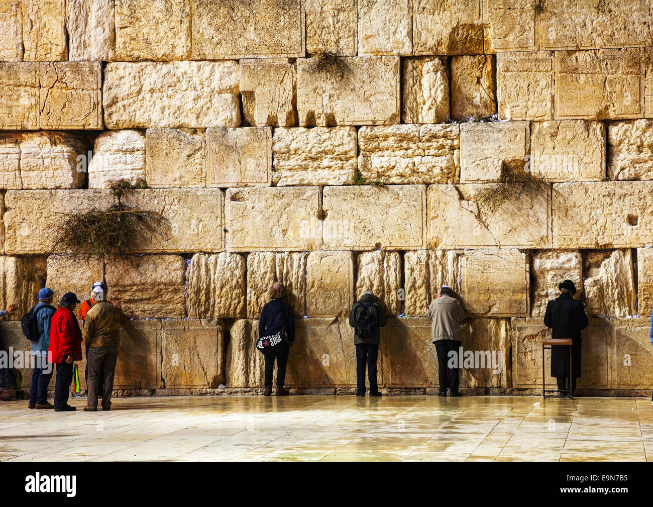 The Western Wall with a praying pilgrims Stock Photo - Alamy