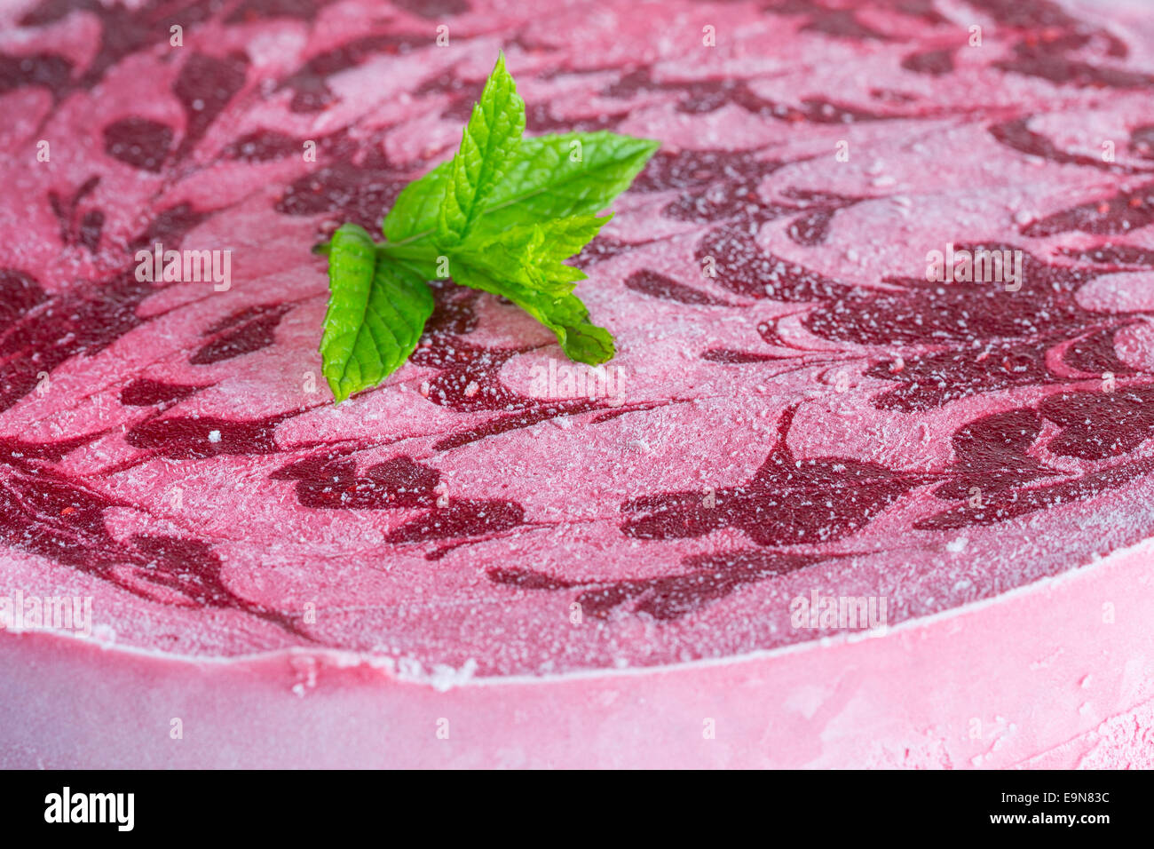 Raspberry ice cream cake on white rustic wood Stock Photo - Alamy