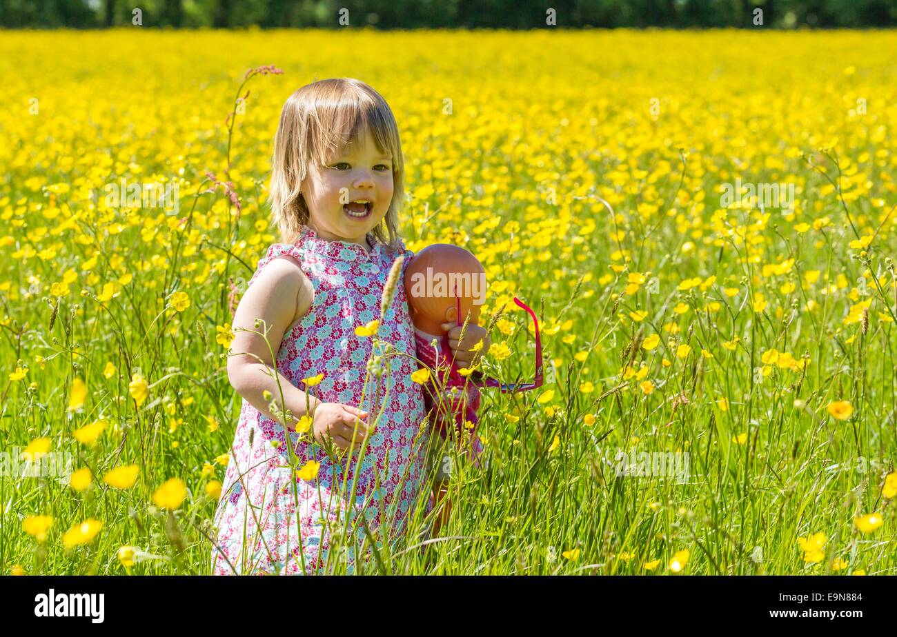 Rose Blythe, 22 months, enjoys a field of buttercups near Havant ...