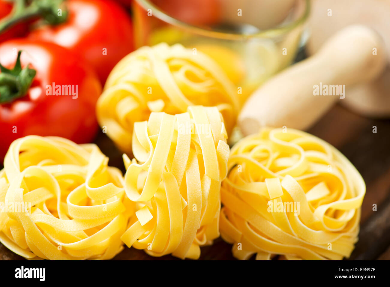 Pasta ready for cooking on table Stock Photo - Alamy