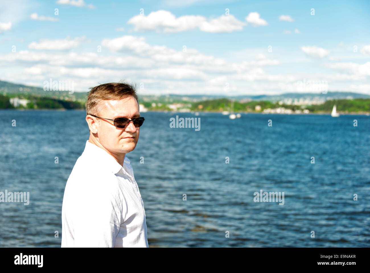 Man portrait with sea on background Stock Photo - Alamy