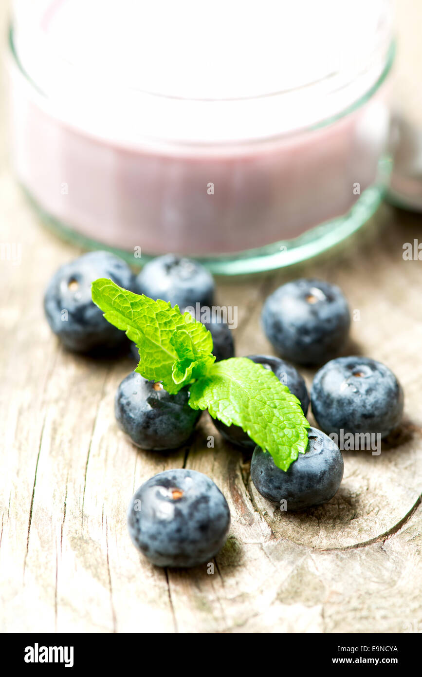 Blueberries on wooden table vertical Stock Photo - Alamy