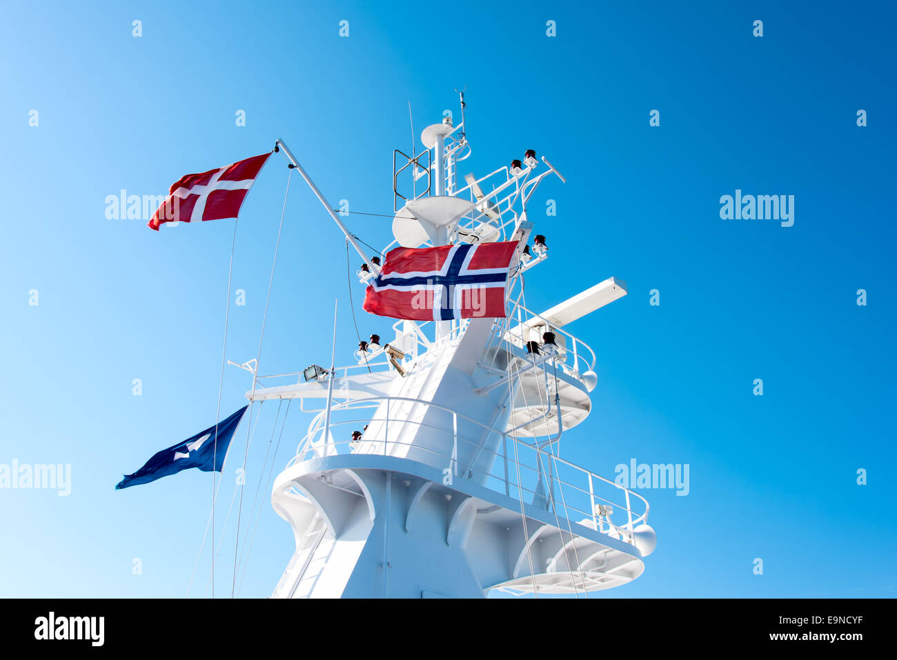 Flags on mast tower Stock Photo - Alamy
