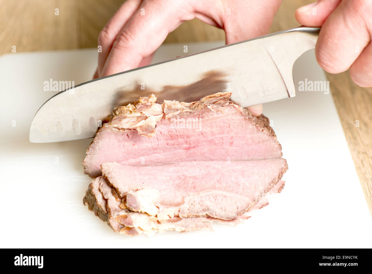 Cutting baked ham Stock Photo - Alamy