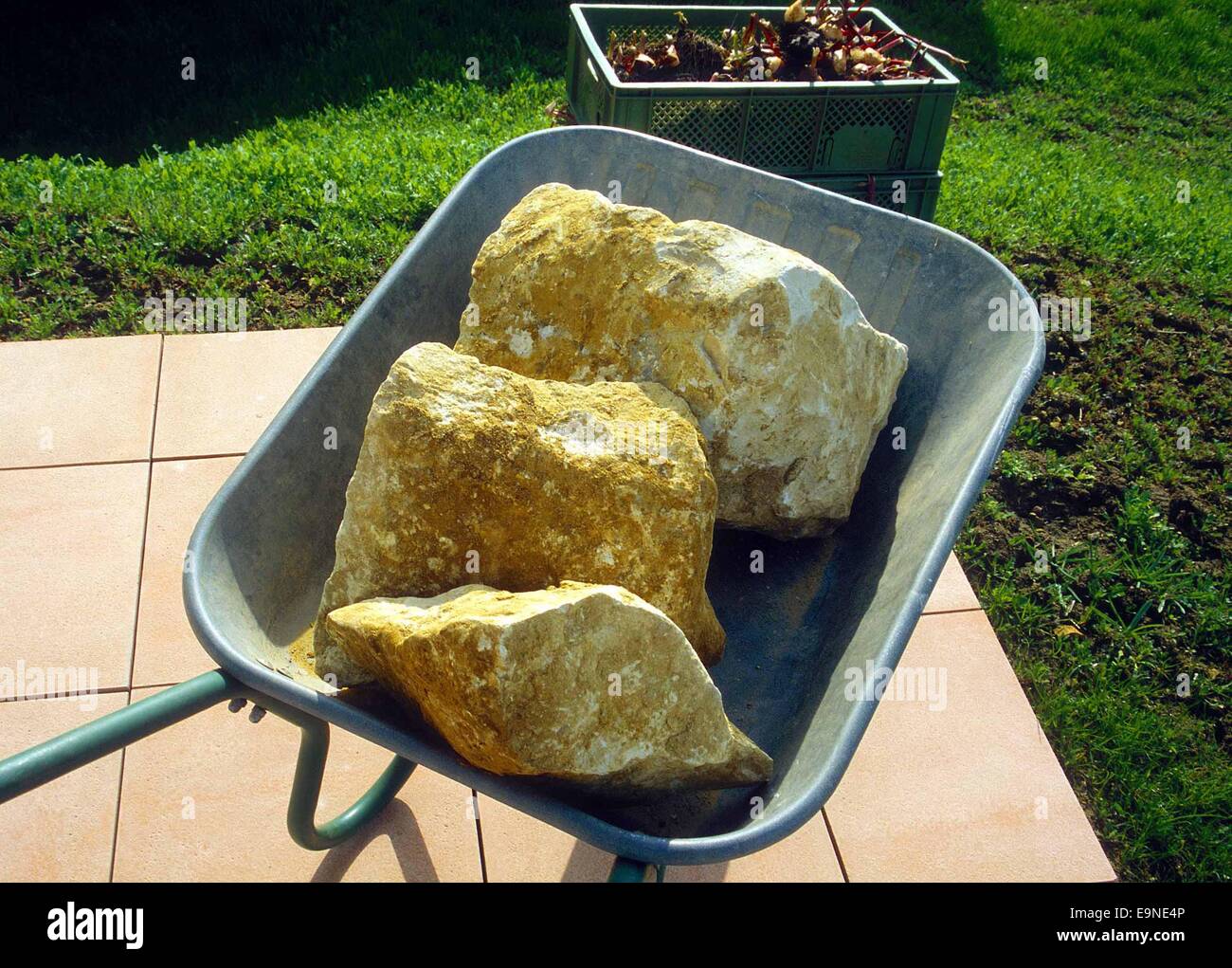 Rocks and wheelnbarrow Stock Photo - Alamy