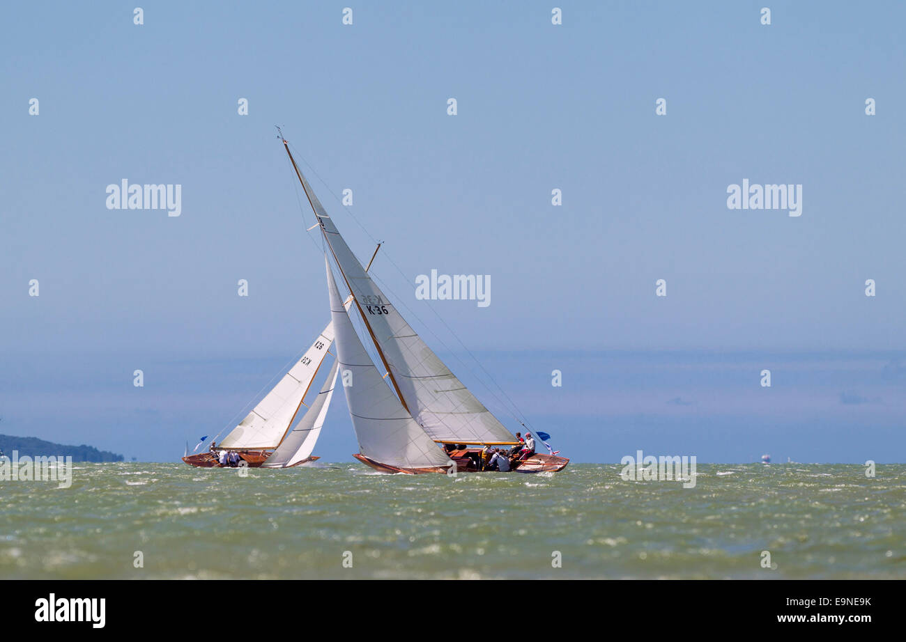 The Eight Metre yachts Saskia (left) and Athena cross while competing ...