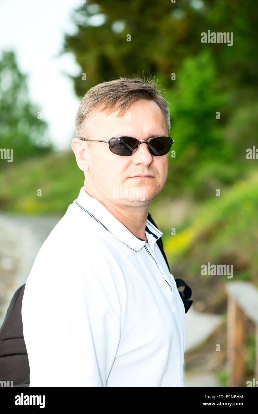 Man in green polo shirt hi-res stock photography and images - Alamy