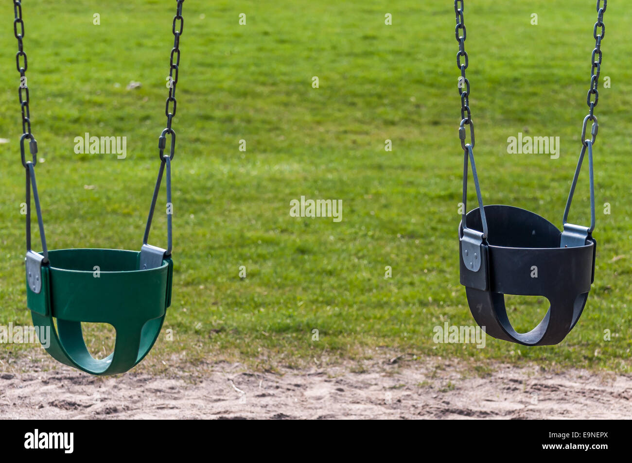 Two empty child swings Stock Photo - Alamy