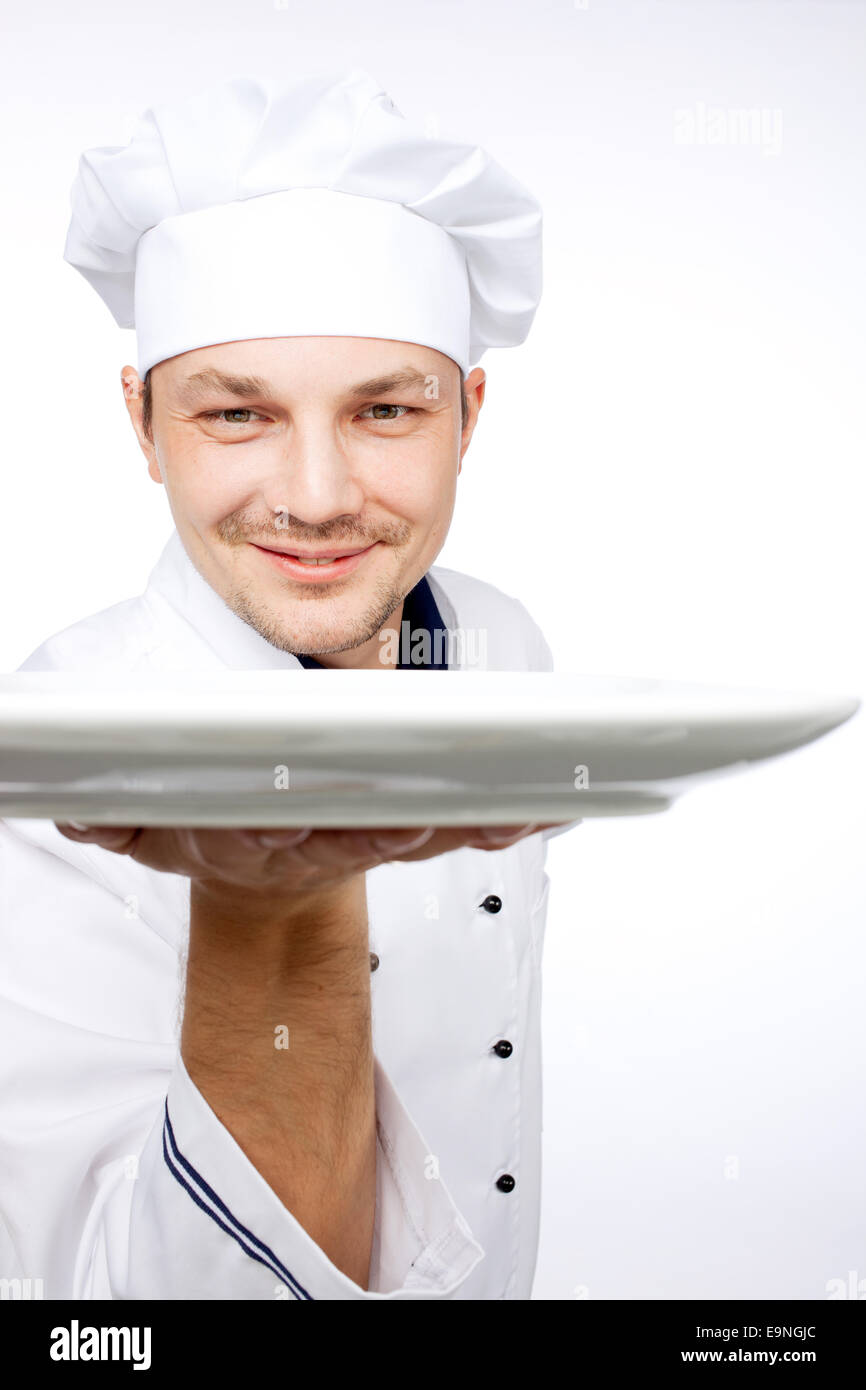 chef holding empty plate Stock Photo - Alamy
