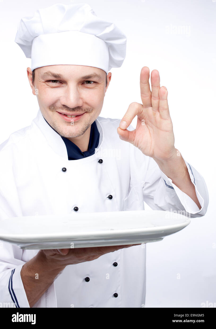 chef holding empty plate Stock Photo - Alamy