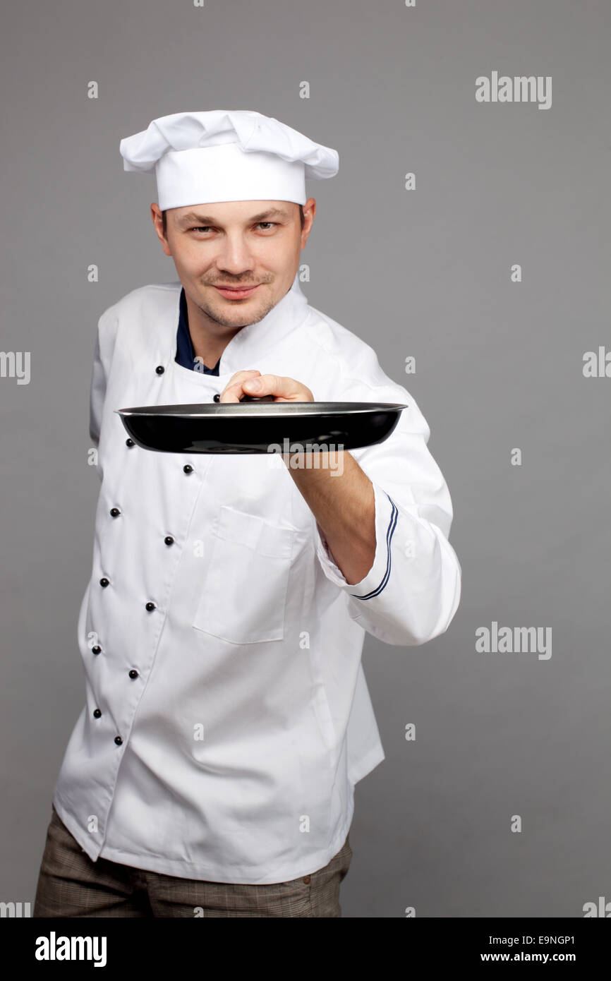 chef holding frying pan Stock Photo - Alamy
