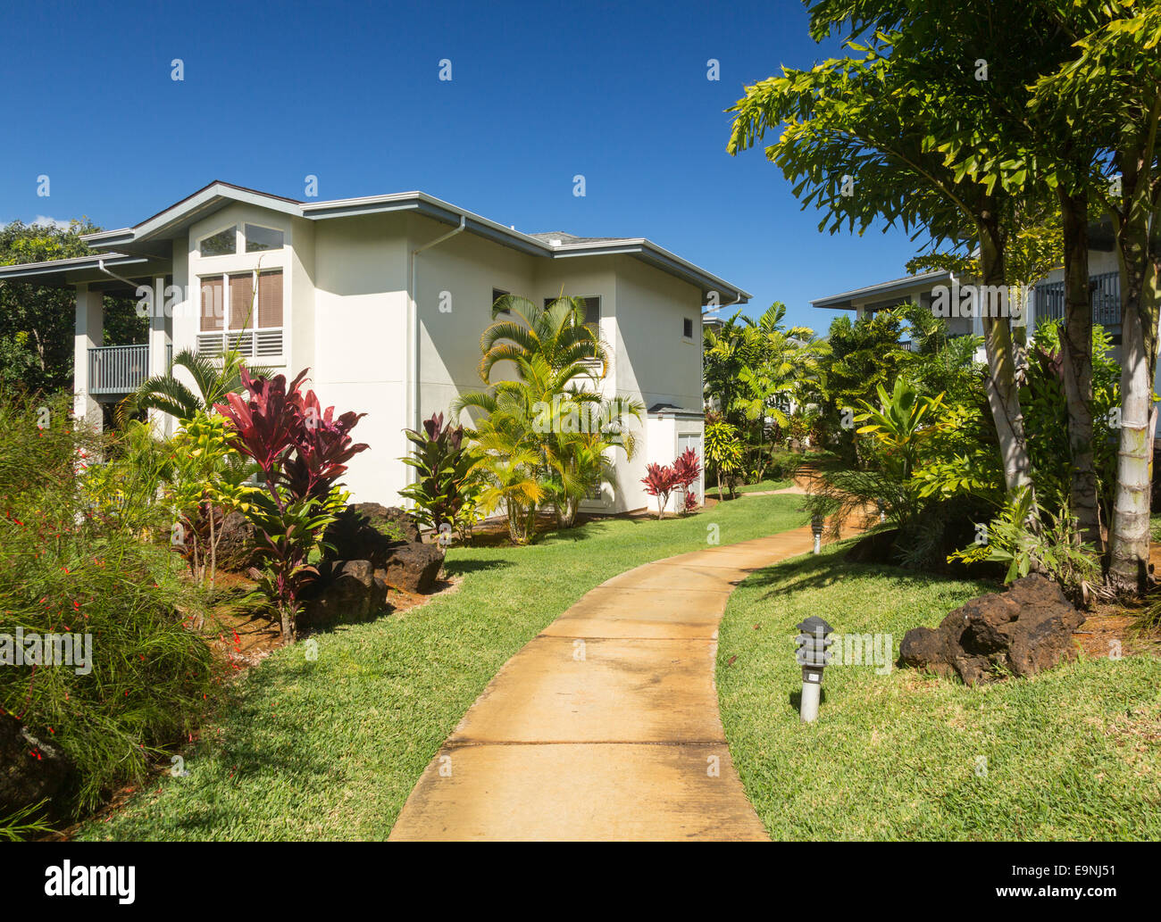 Pathway through landscaped ground at resort Stock Photo - Alamy