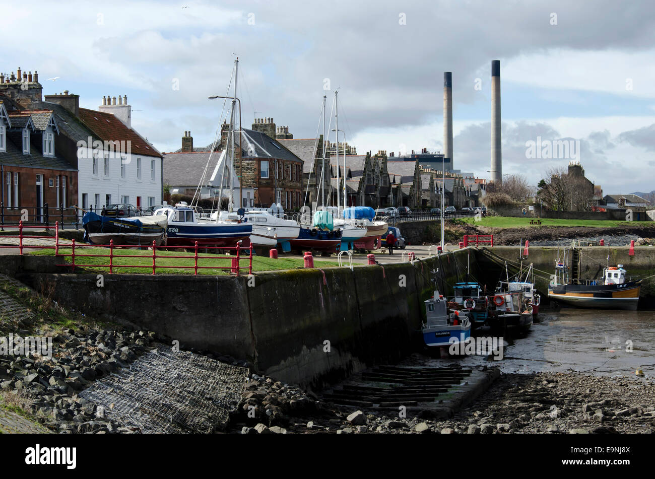 Port Seton Harbour, near Edinburgh, Scotland, with the tide out. The ...