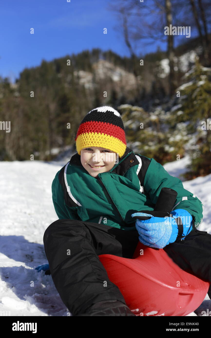 Boy sledge hi-res stock photography and images - Alamy