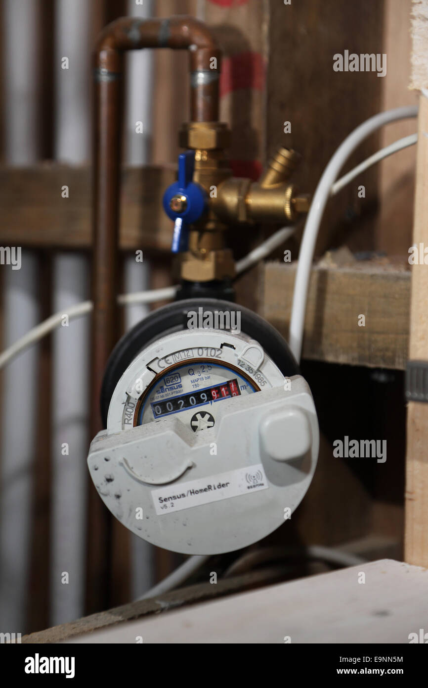 A modern, domestic 'smart' water meter connected and operating. Shows ...