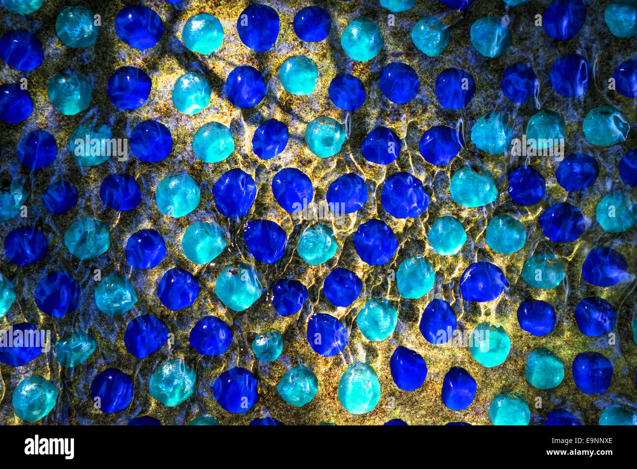 Blue stones in the water Stock Photo - Alamy