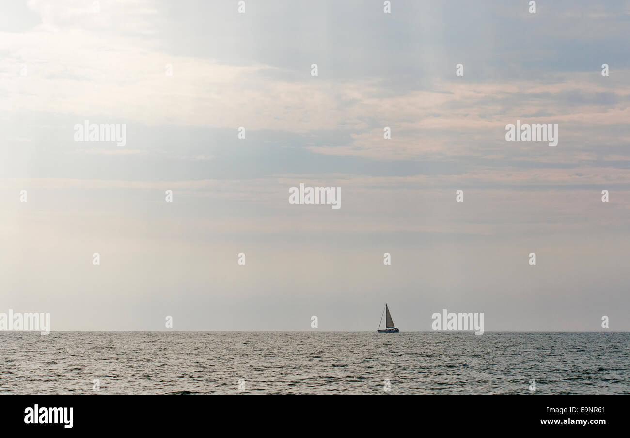 Mediterranean seascape with sailing yacht in sunset Stock Photo - Alamy