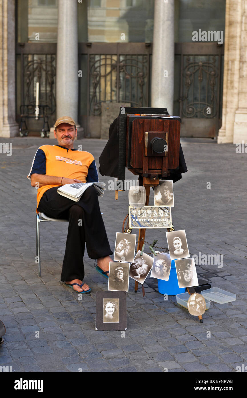 A street photographer using a vintage wooden camera in the City of Rome ...
