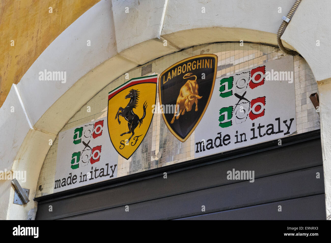 Famous prestigious Italian brands emblems at the entrance of a shop in ...