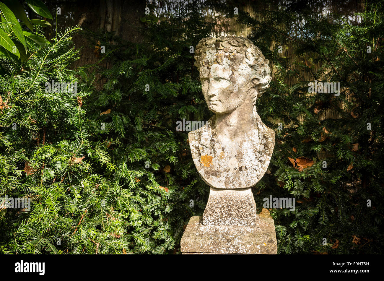 Statue of male in Roman style in a quiet corner of The Courts garden ...