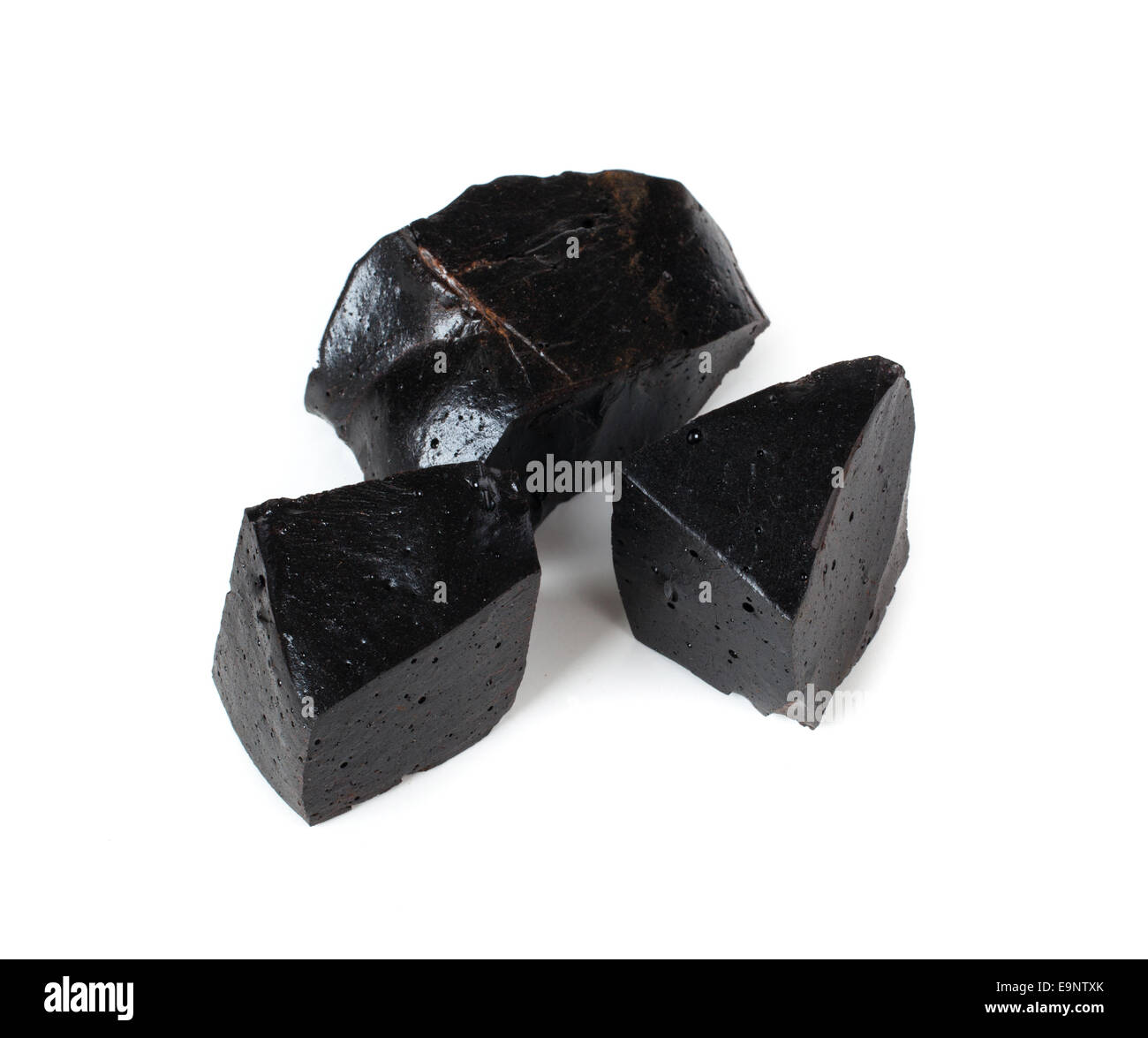 Pure blocks of black licorice on white background Stock Photo - Alamy