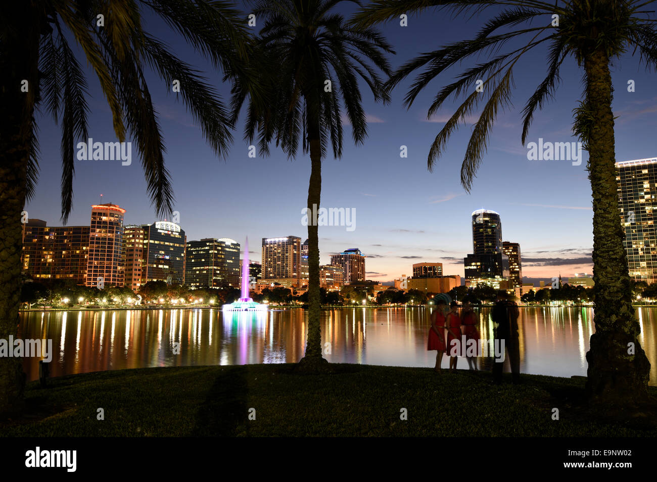 View from Lake Eola of downtown Orlando, Florida at sunset with people ...