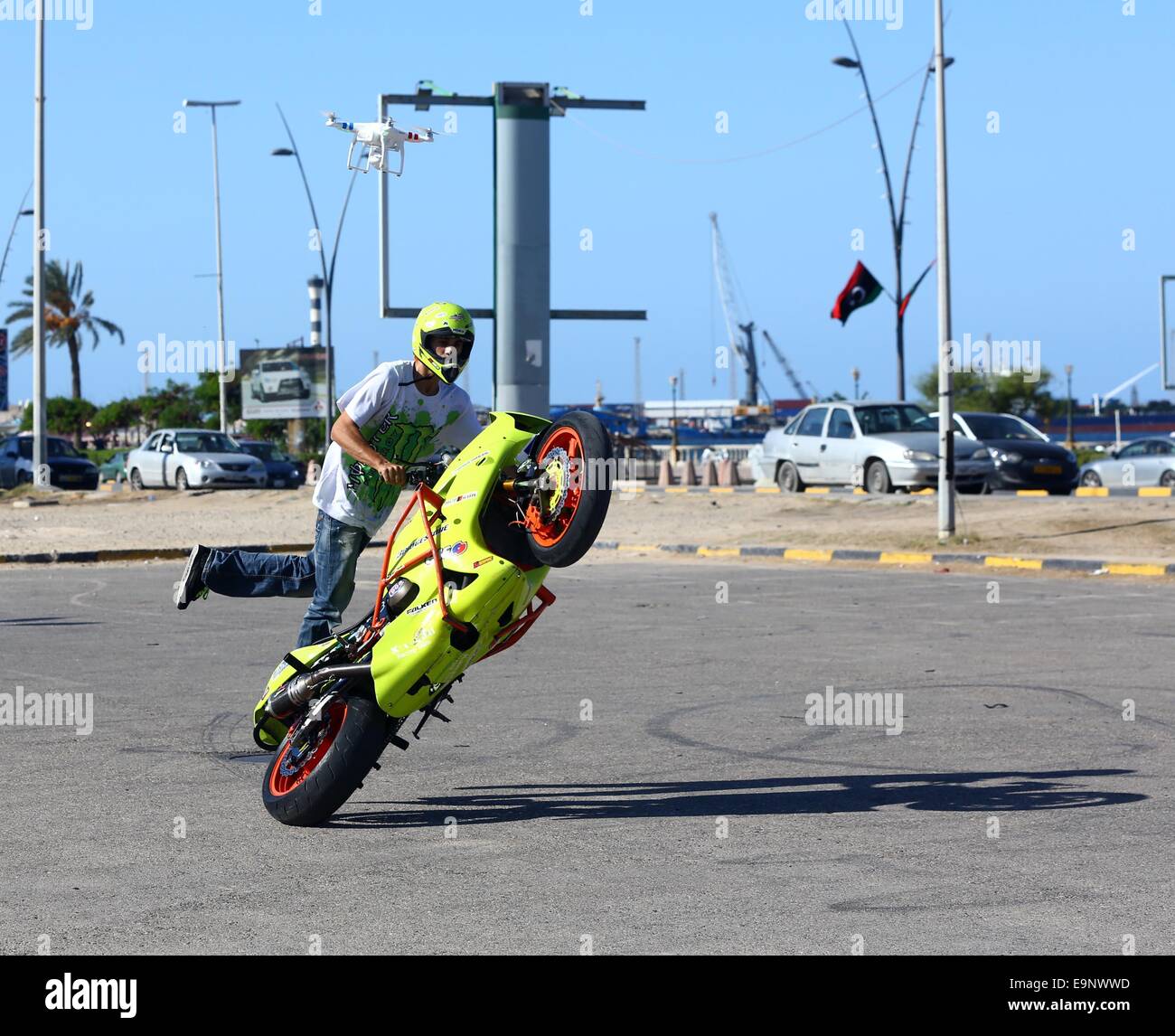 Tripoli, Libya. 30th Oct, 2014. A Libyan young man shows his motorcycle ...