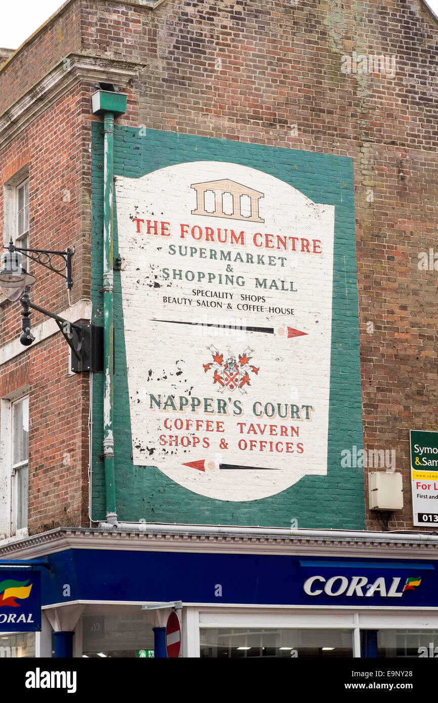 Hand painted advertising sign on brick wall Stock Photo - Alamy