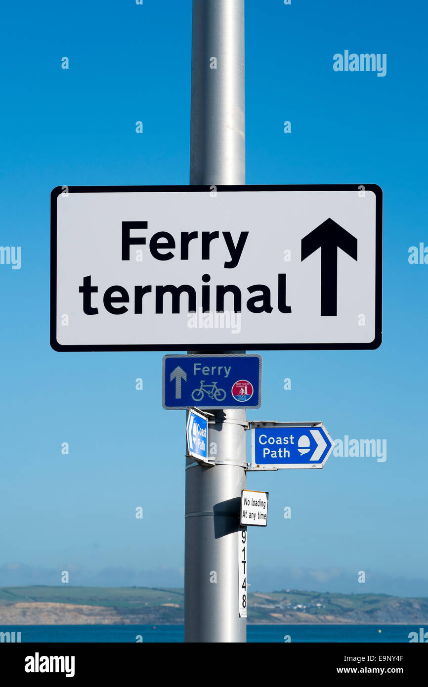 Ferry terminal sign on metal post against blue sky Weymouth Dorset UK ...
