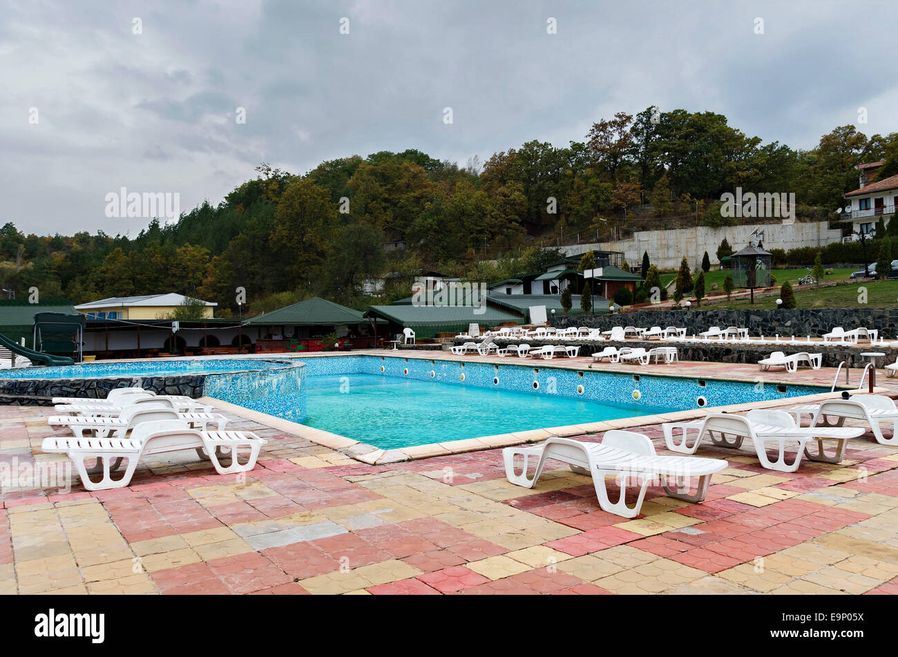 Dam shore resort with swimming pool Stock Photo - Alamy