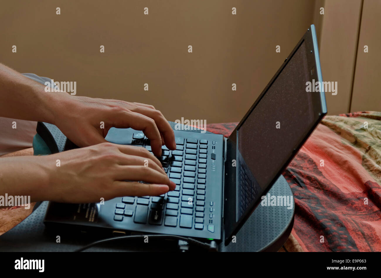 A businessman working on a laptop computer in home Stock Photo - Alamy