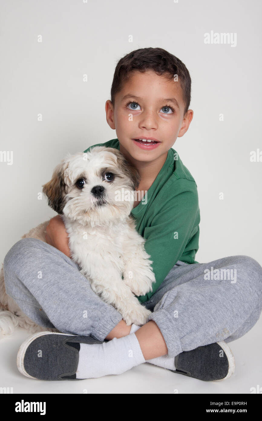 Young boy with white dog hi-res stock photography and images - Alamy