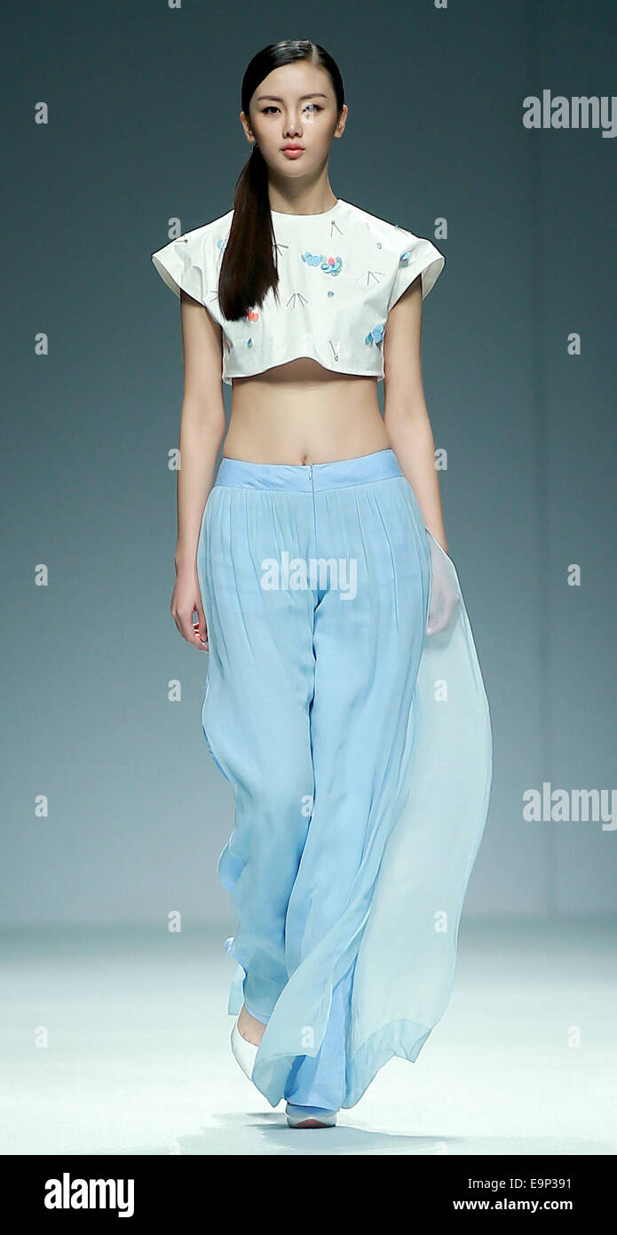 Beijing, China. 30th Oct, 2014. A model presents a creation designed by ...