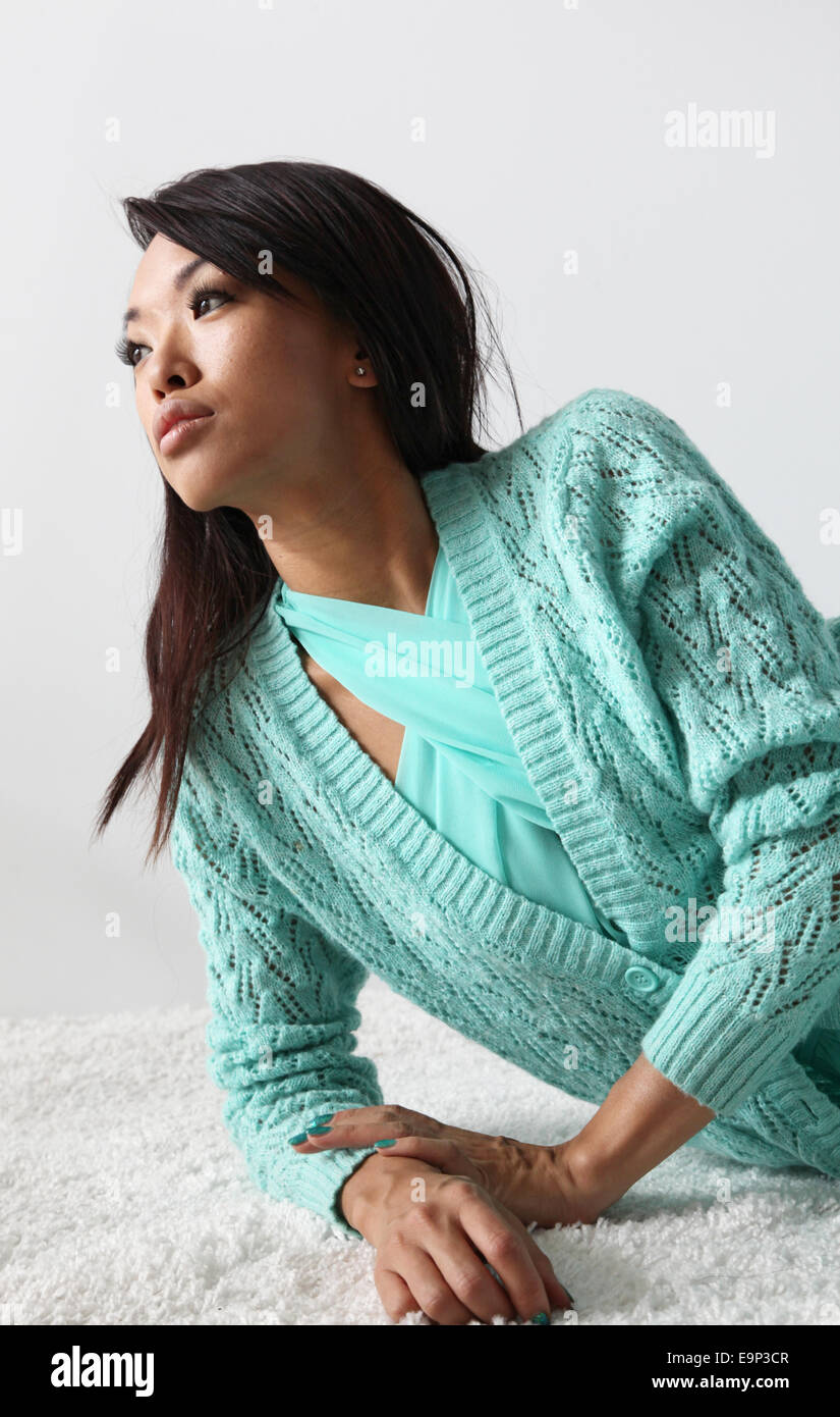 woman leaning on arm reclining on floor Stock Photo - Alamy