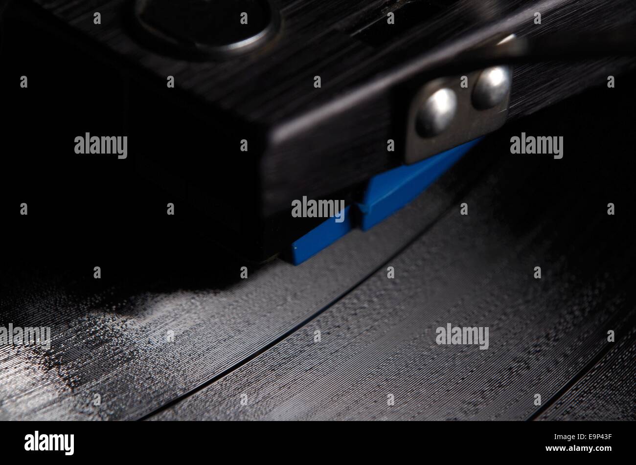 Close up magnification of a vinyl record playing on a turntable Stock ...