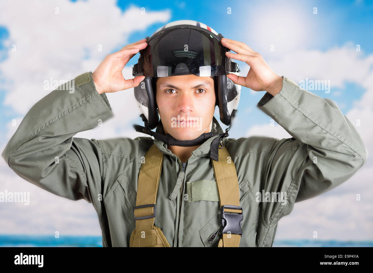 portrait of young pilot wearing helmet with a sky background Stock ...