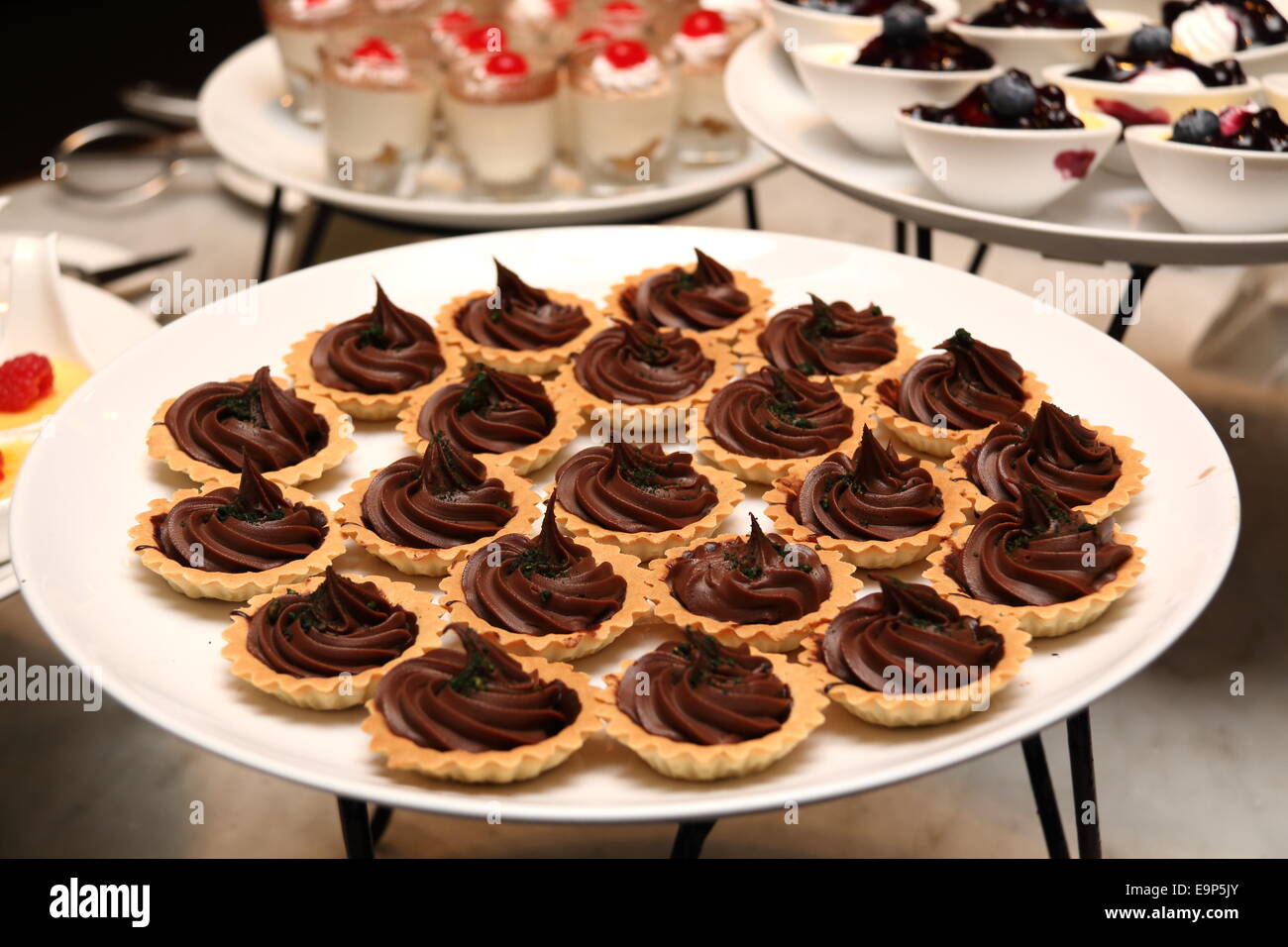 Sweet chocolate mini tart on the food table Stock Photo - Alamy