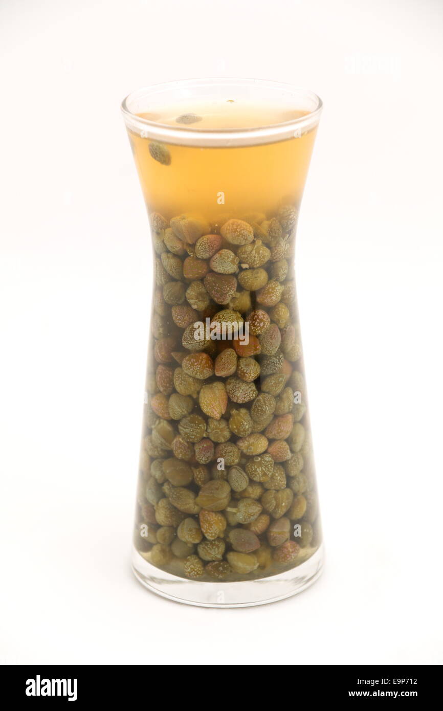 Glass jar with tinned capers isolated on white Stock Photo - Alamy