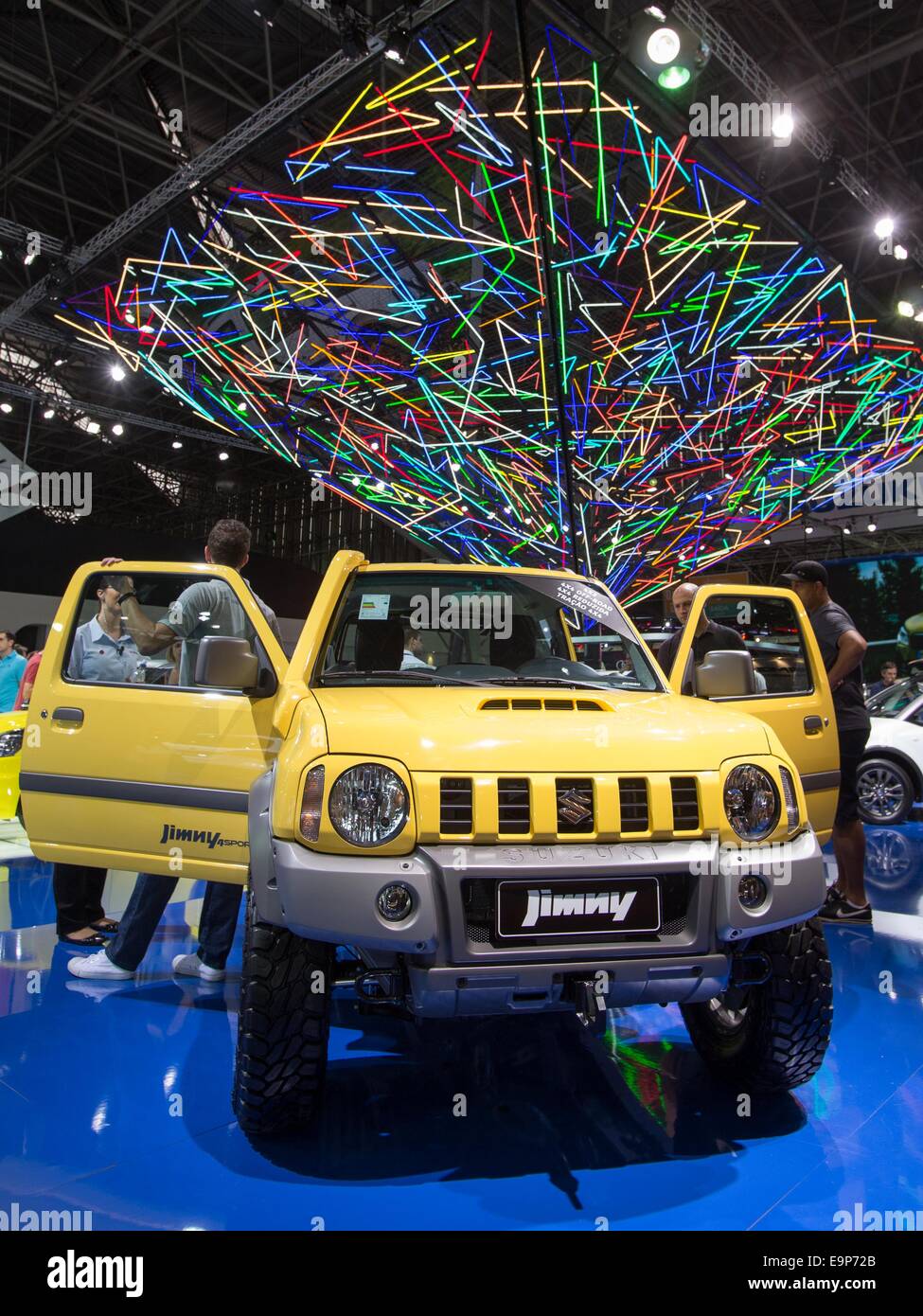 Sao Paulo. 30th Oct, 2014. Visitors look at the exhibited Suzuki "Jimmy ...