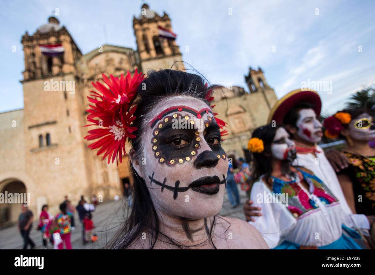 A woman dressed as Catrina, the bride of death, dances in front of the ...