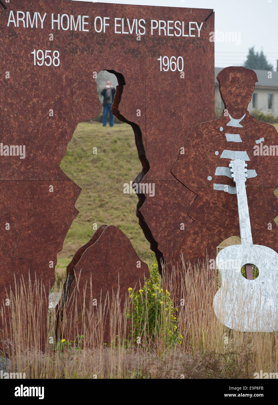 A plate depicting Elvis Presley stands on a traffic roundabout near the ...