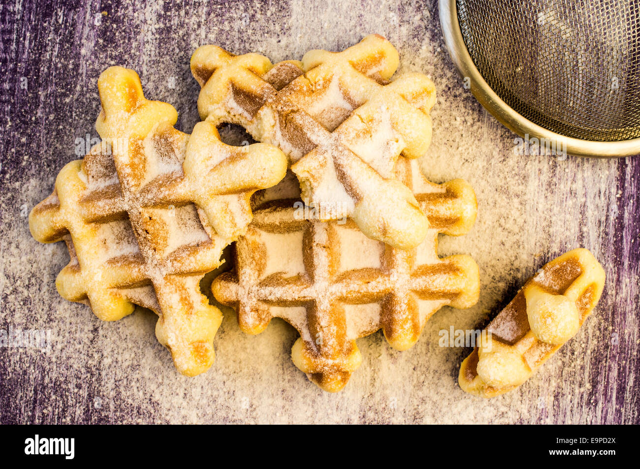 Homemade waffles in powdered sugar close sieve Stock Photo - Alamy